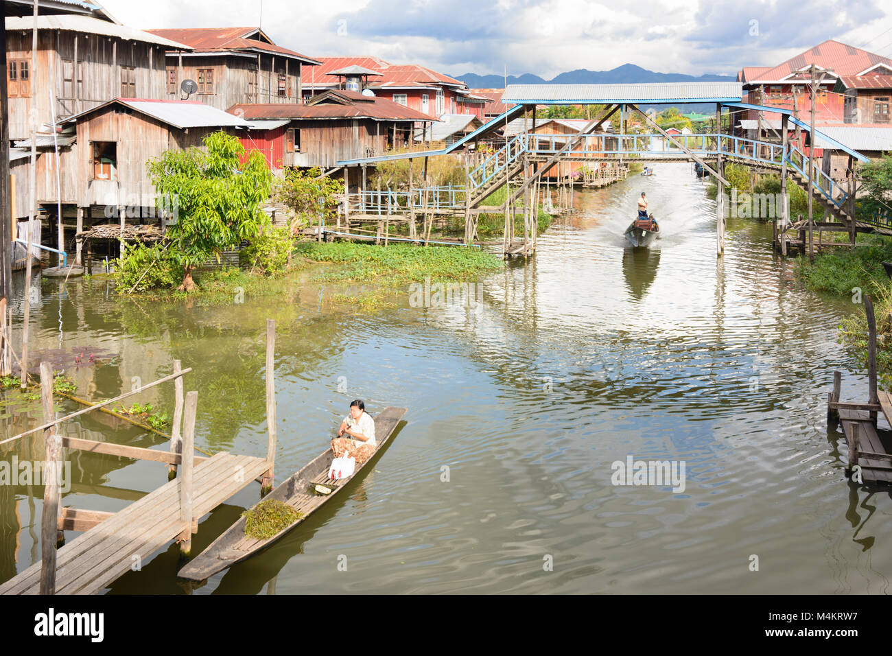 Nampan: house on stilts, canal, boat, Inle Lake, Shan State, Myanmar ...
