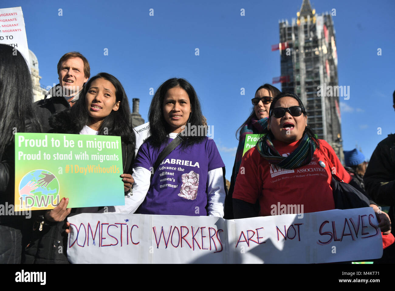 People take part in the One Day Without Us rally, a national day of ...