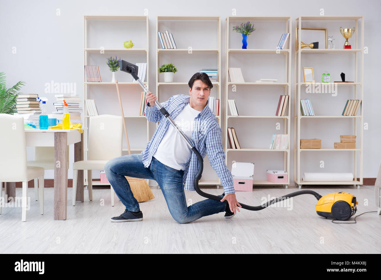Man doing cleaning at home Stock Photo - Alamy