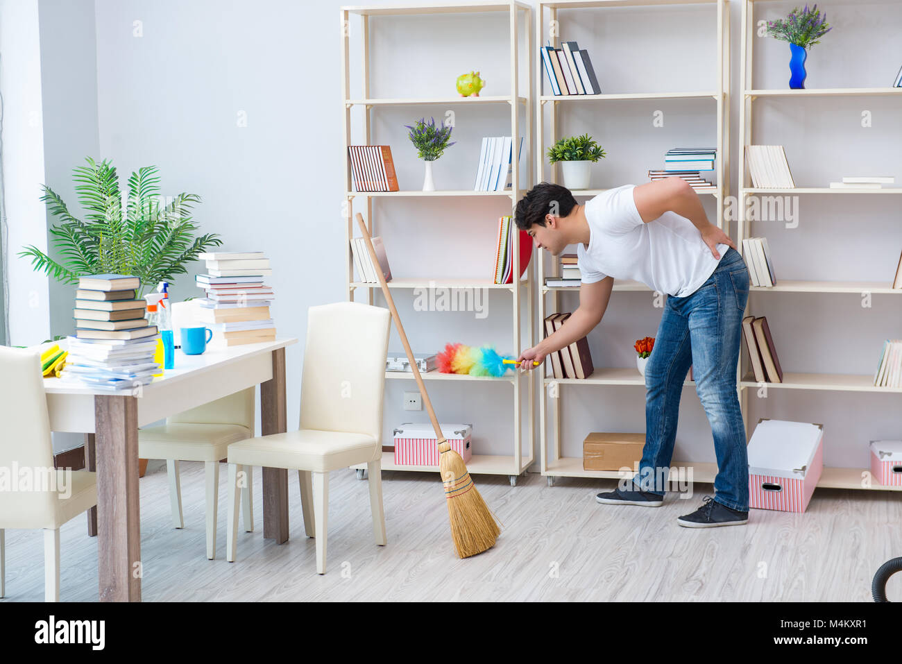 Man doing cleaning at home Stock Photo - Alamy
