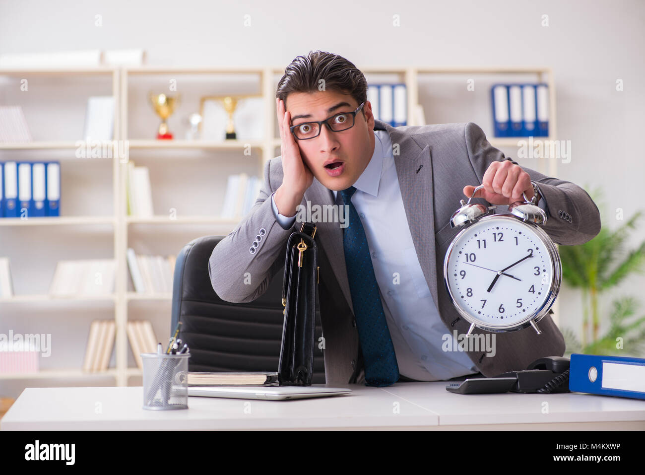 Businessman rushing in the office Stock Photo - Alamy