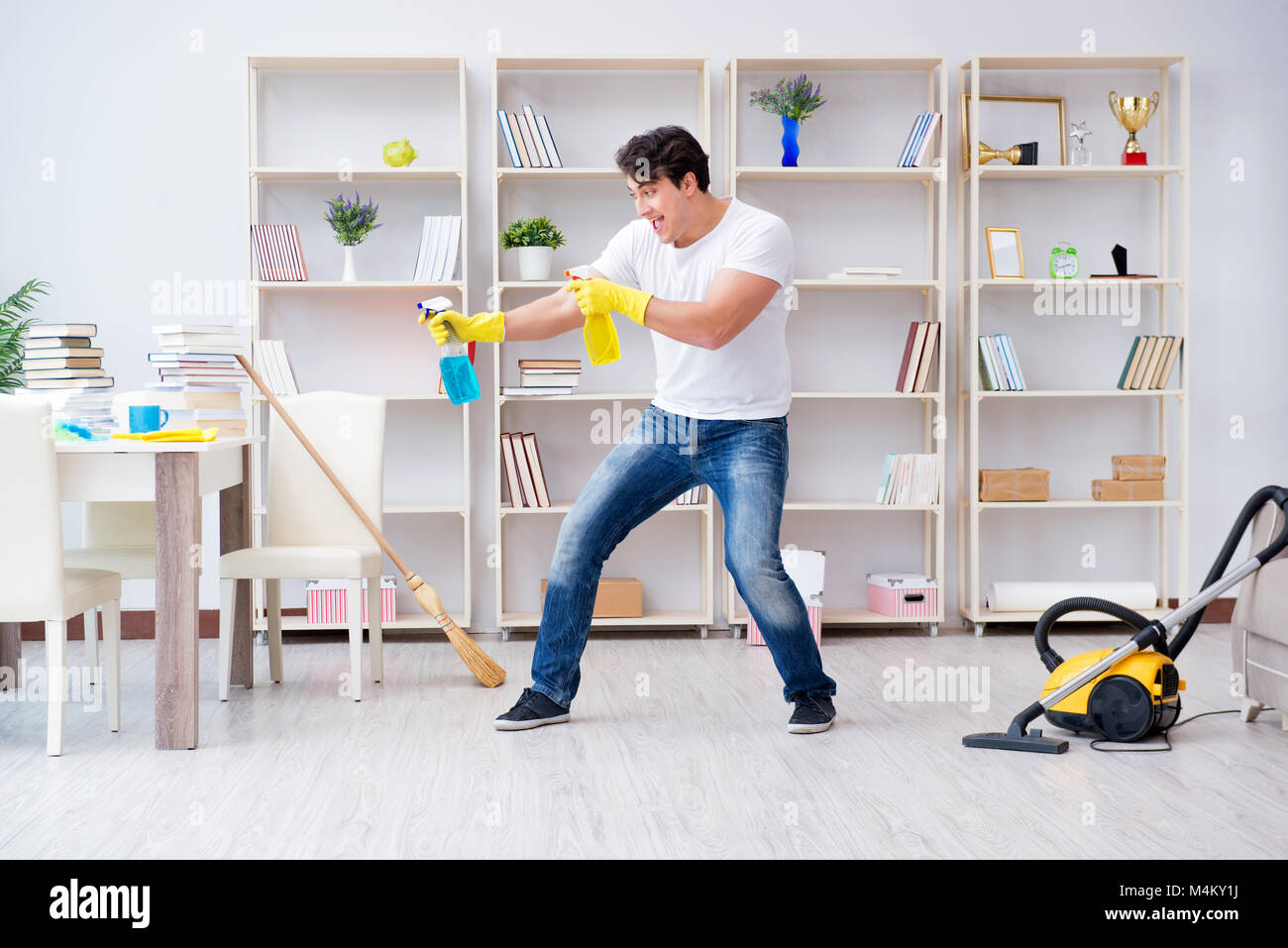 Man doing cleaning at home Stock Photo - Alamy