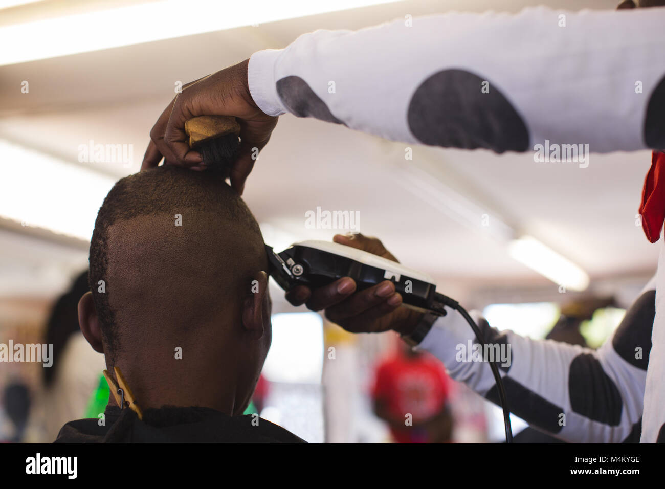 Barber trimming customer hair Stock Photo - Alamy