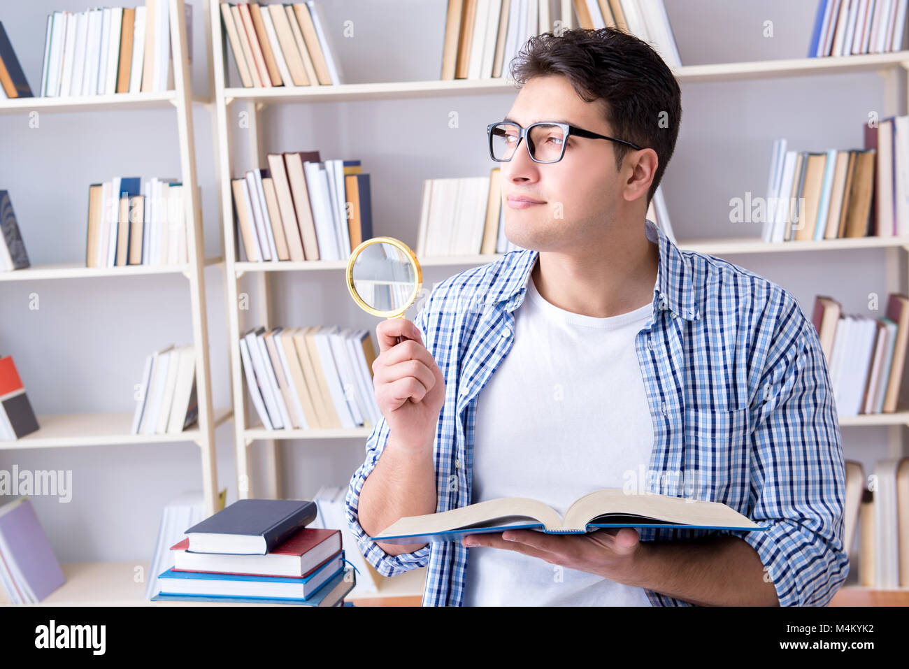 Young student with books preparing for exams Stock Photo - Alamy