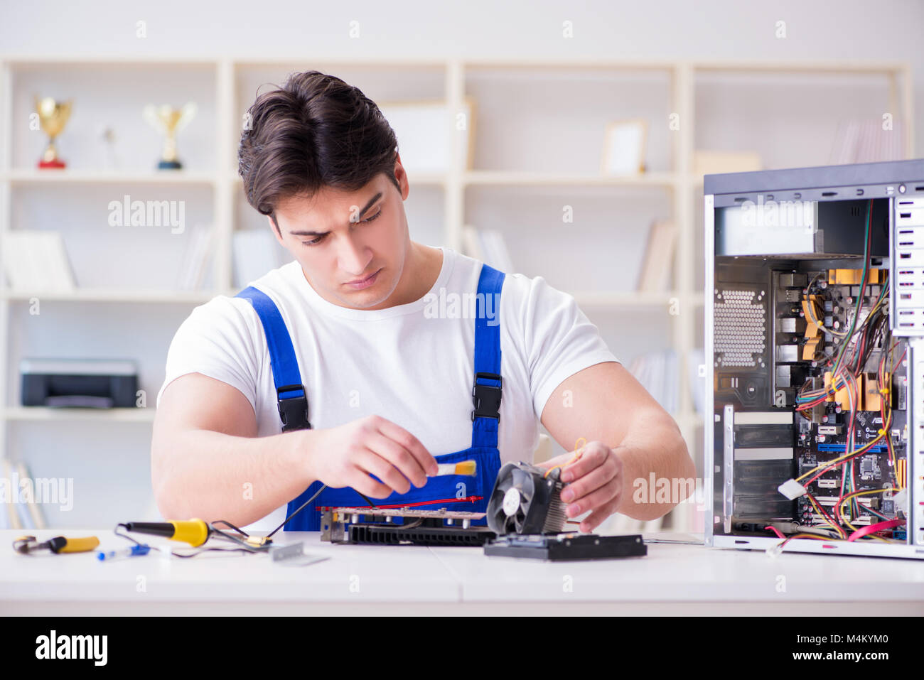 Computer repairman repairing desktop computer Stock Photo - Alamy