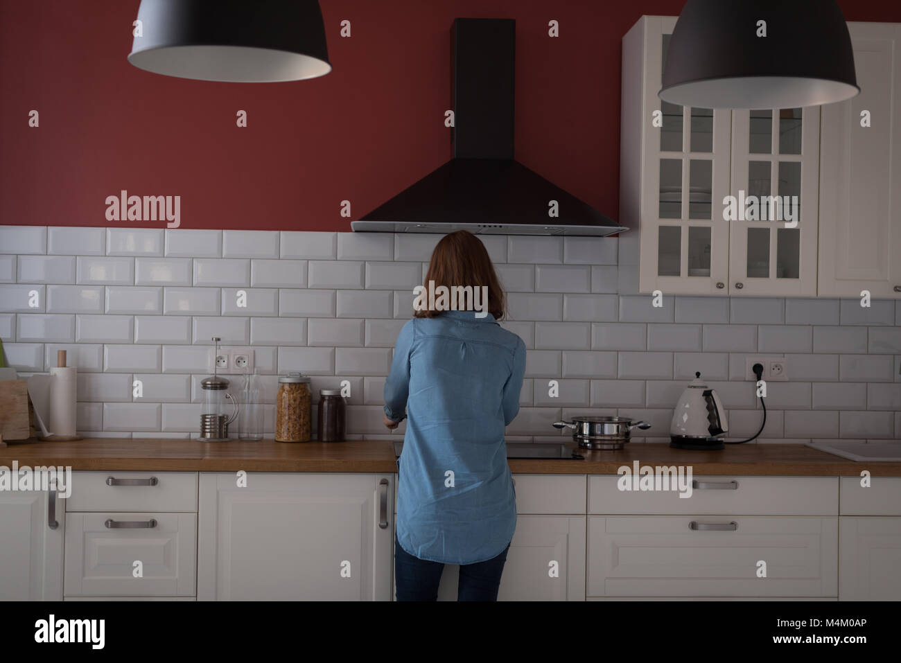Woman working in the kitchen Stock Photo - Alamy