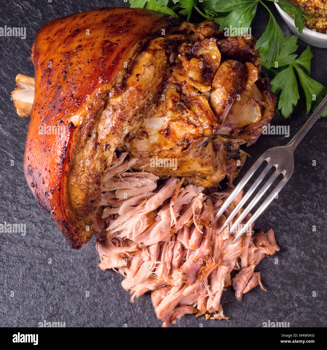 fresh roasted knuckle of pork with mustard Stock Photo - Alamy