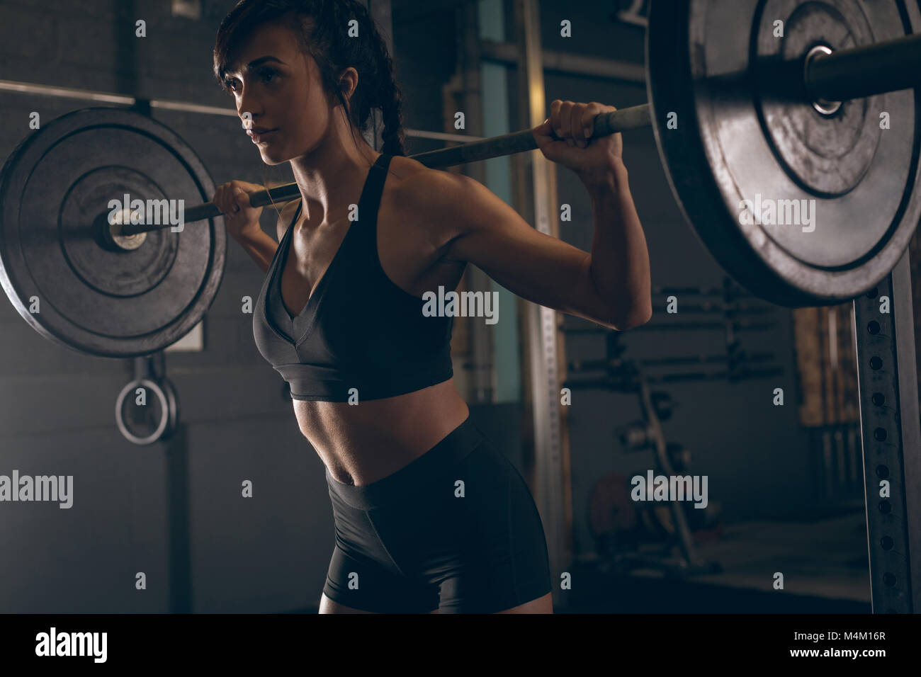 Fit woman lifting the barbell Stock Photo - Alamy