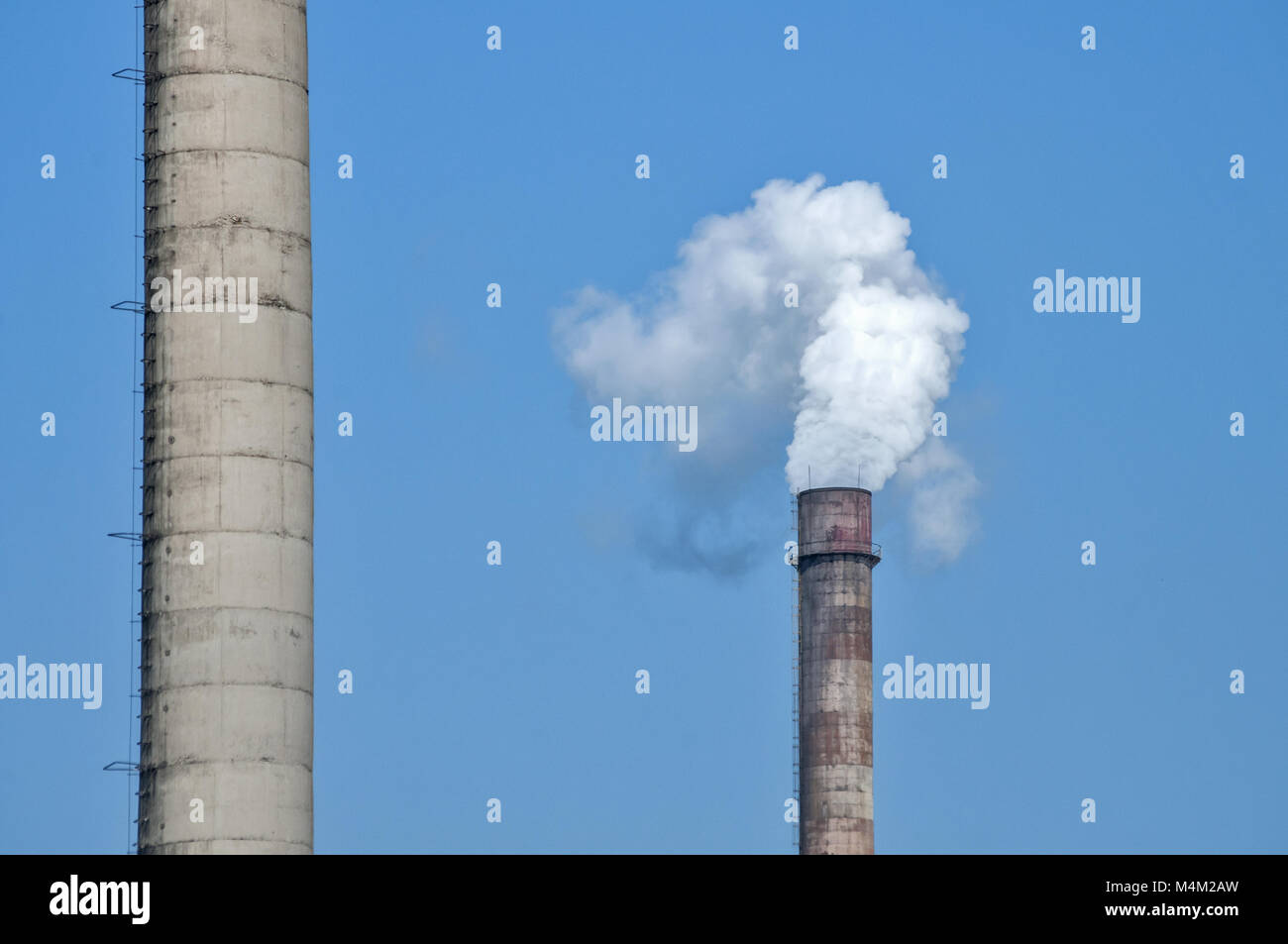 Industrial chimney with smoke Stock Photo - Alamy