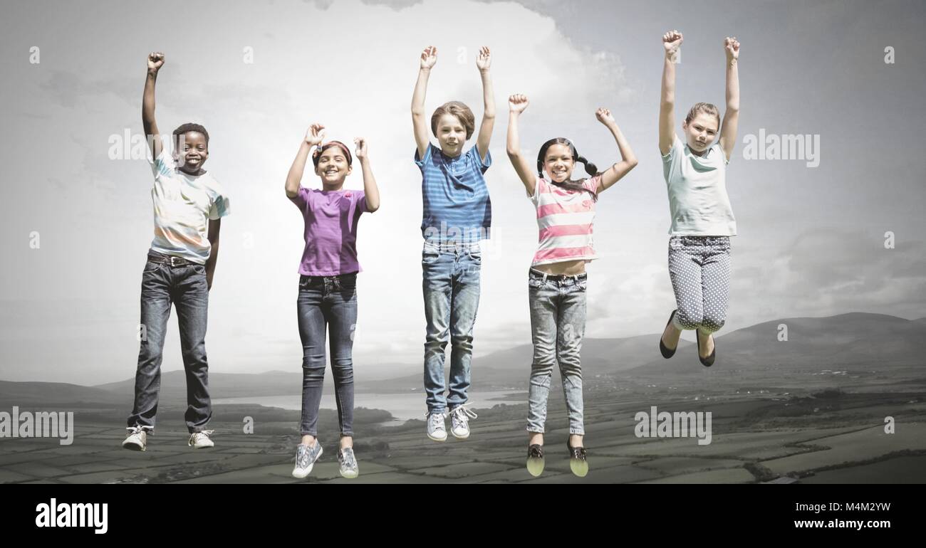 Children jumping in air in park hi-res stock photography and images - Alamy
