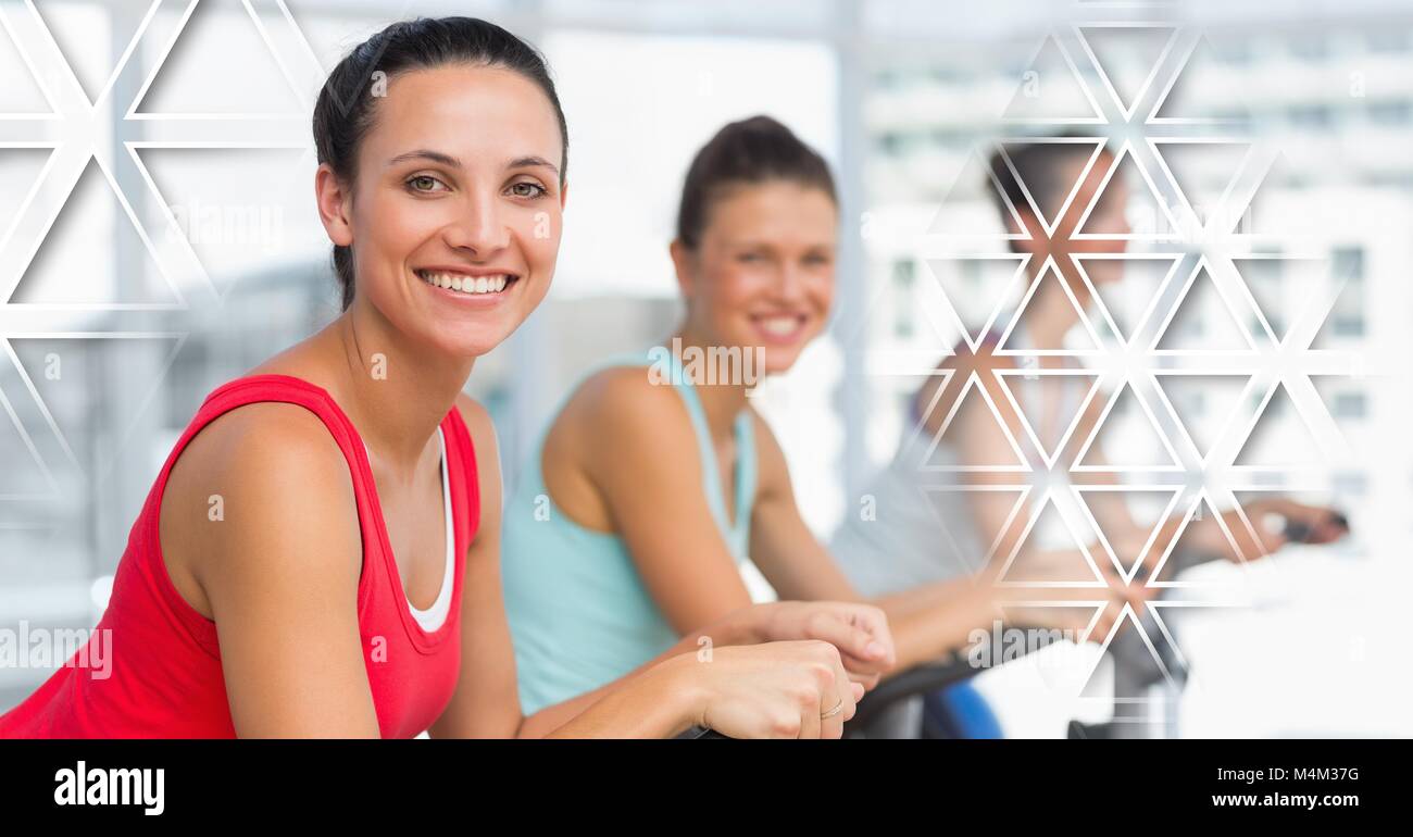 Athletic fit women in gym with triangle interface Stock Photo - Alamy