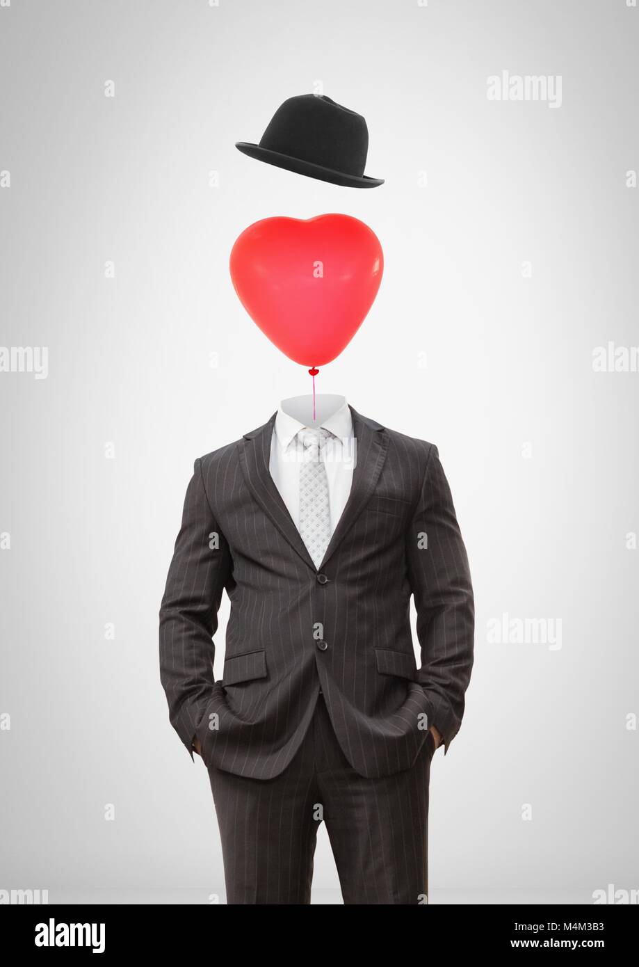 Headless man with surreal floating hat and heart balloon Stock Photo ...