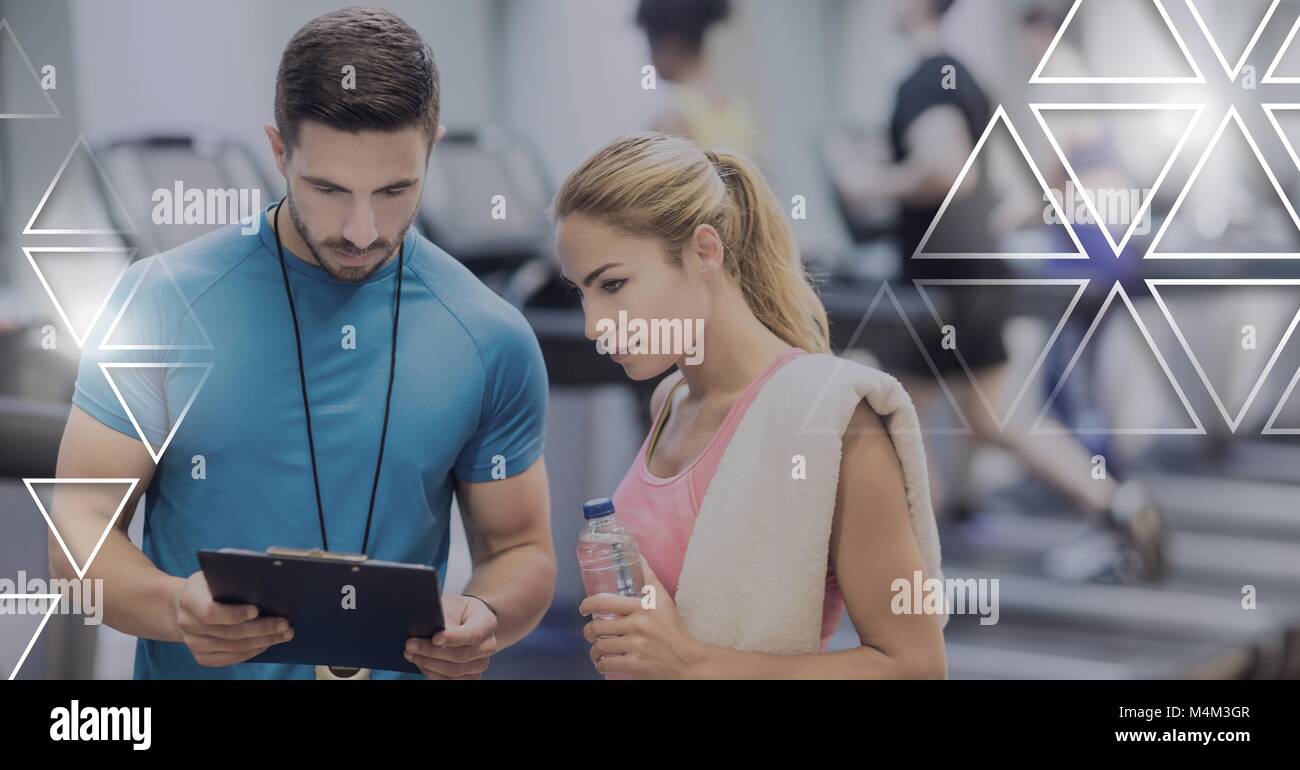Athletic fit trainer people in gym with triangle interface Stock Photo ...