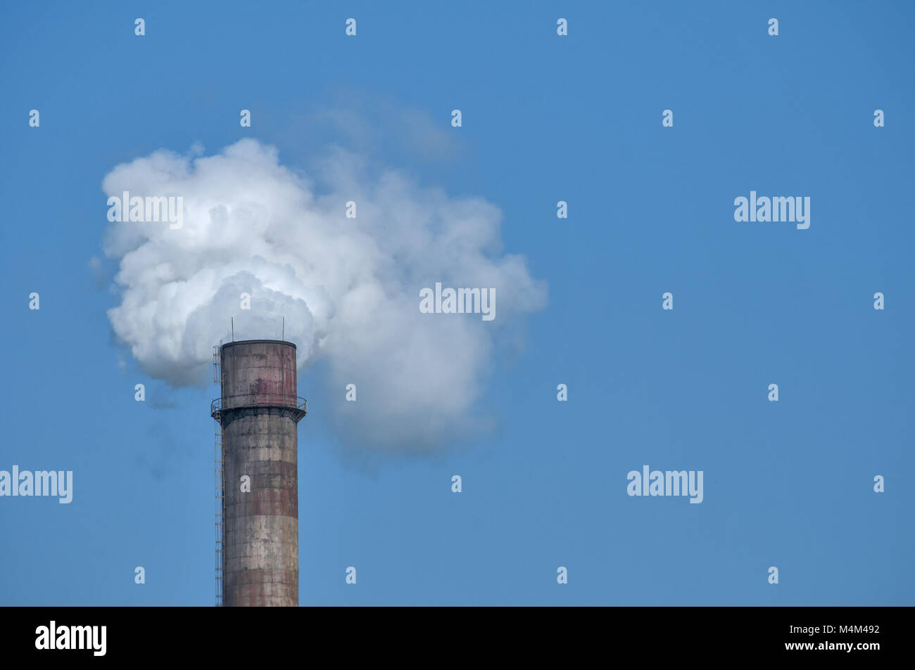 Industrial chimney with smoke Stock Photo - Alamy