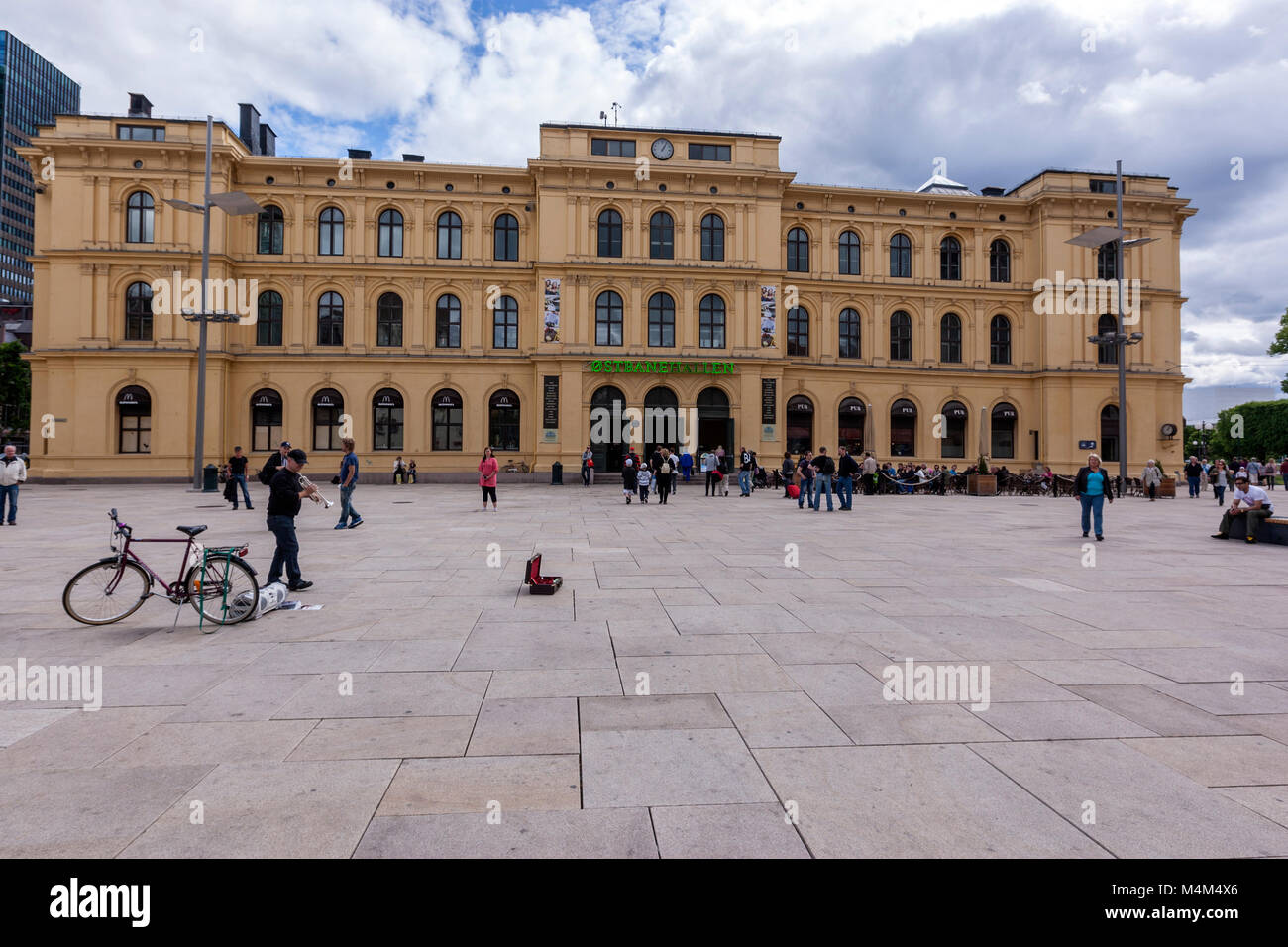Busker outside the Oslo Central Station, Square Jernbanetorget, Oslo ...