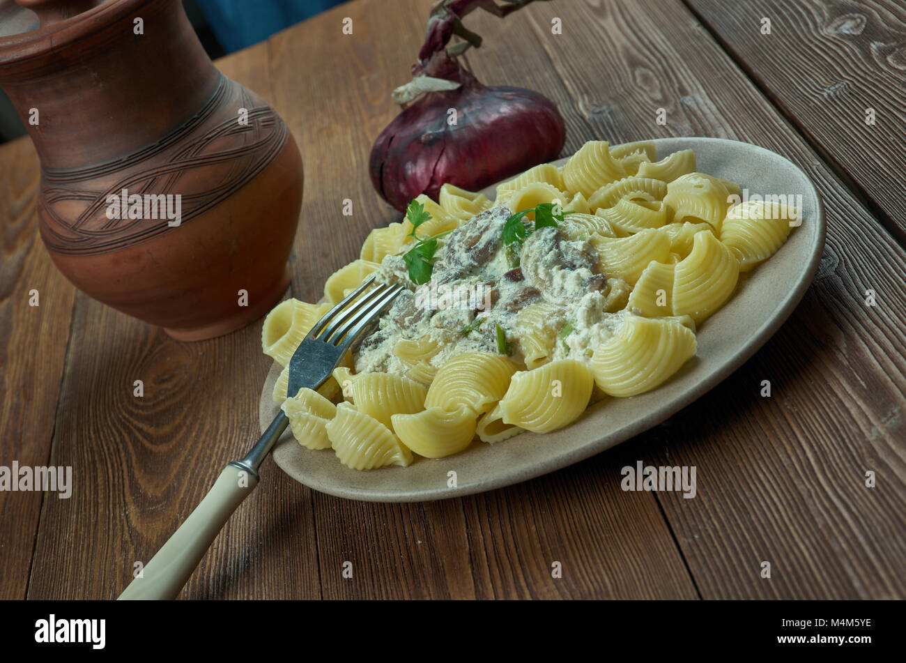 Italian pasta gomiti with mushroom sauce Stock Photo - Alamy