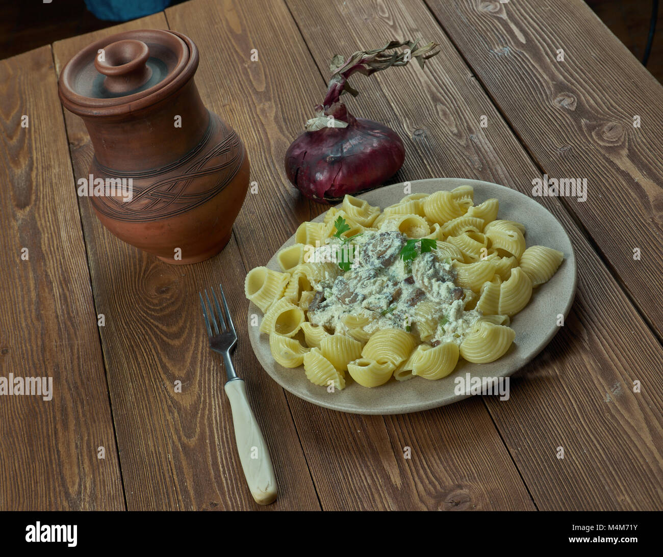 Italian pasta gomiti with mushroom sauce Stock Photo - Alamy