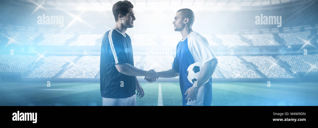 Composite image of football players shaking hands Stock Photo - Alamy