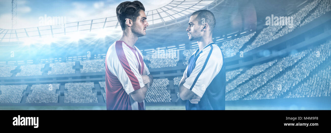 Composite image of confident football players looking at each other ...