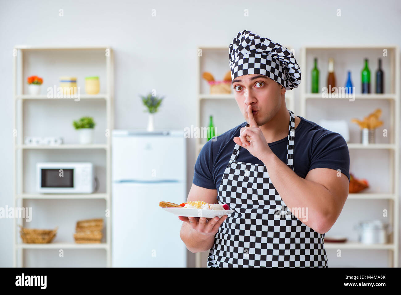 Chef cook cooking a meal breakfast dinner in the kitchen Stock Photo ...