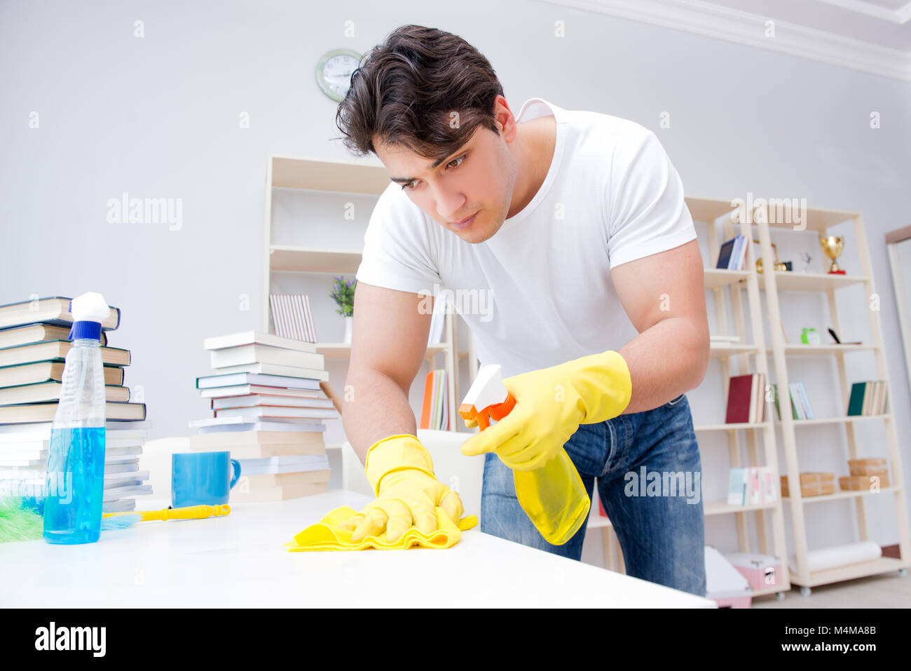 Man doing cleaning at home Stock Photo - Alamy