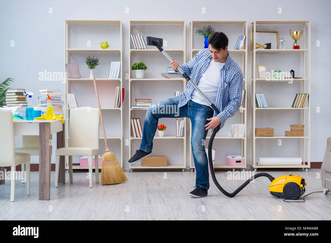 Man doing cleaning at home Stock Photo - Alamy
