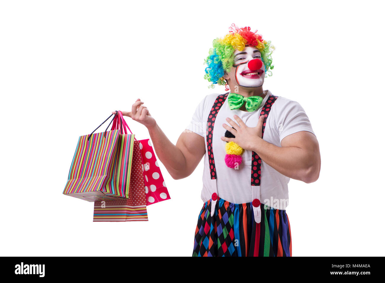 Funny clown after shopping bags isolated on white background Stock ...