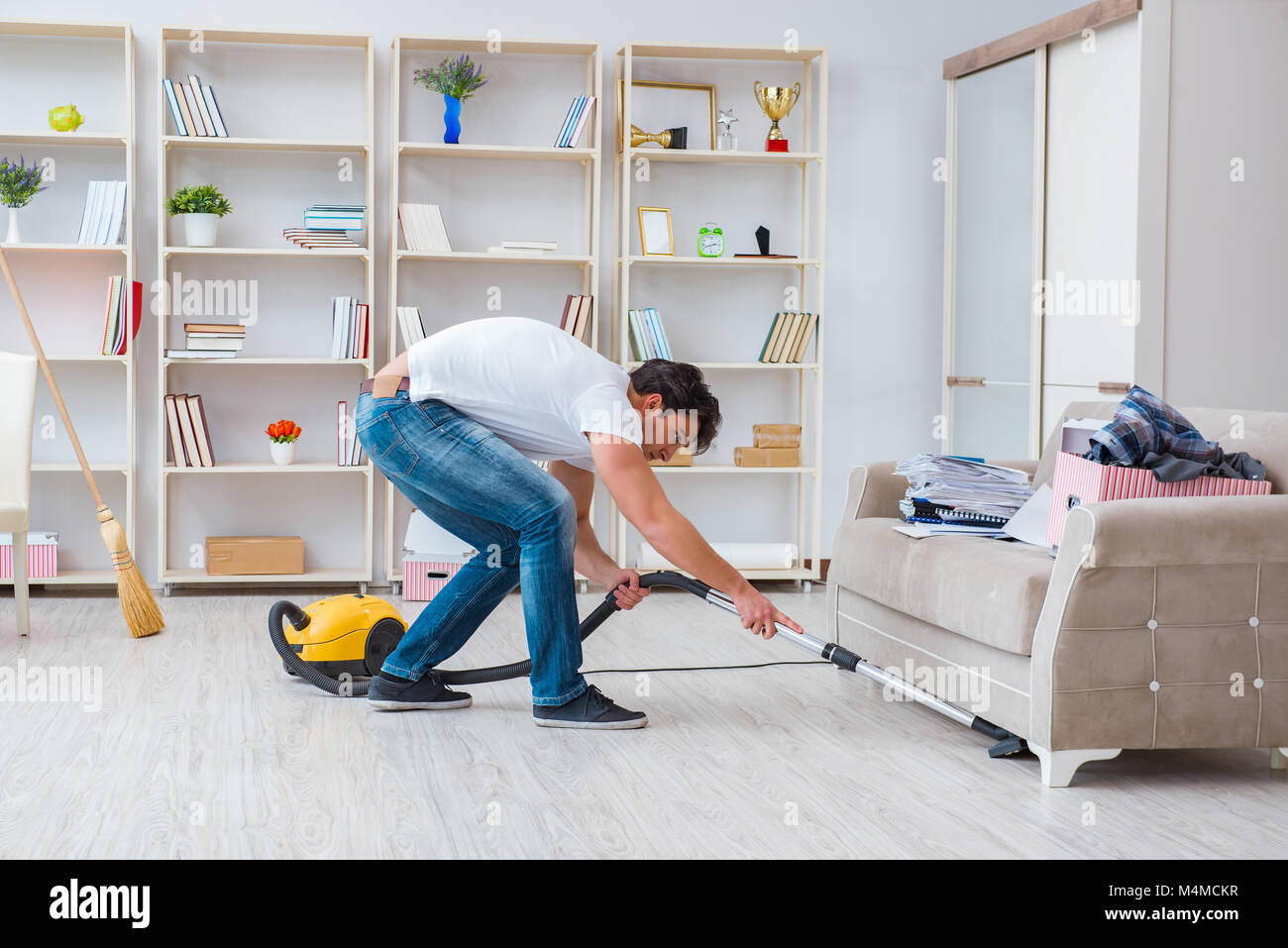Man doing cleaning at home Stock Photo - Alamy