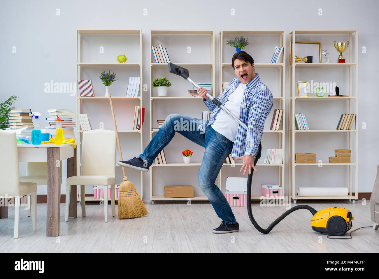 Man doing cleaning at home Stock Photo - Alamy