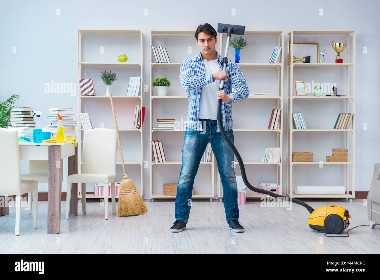 Man doing cleaning at home Stock Photo - Alamy