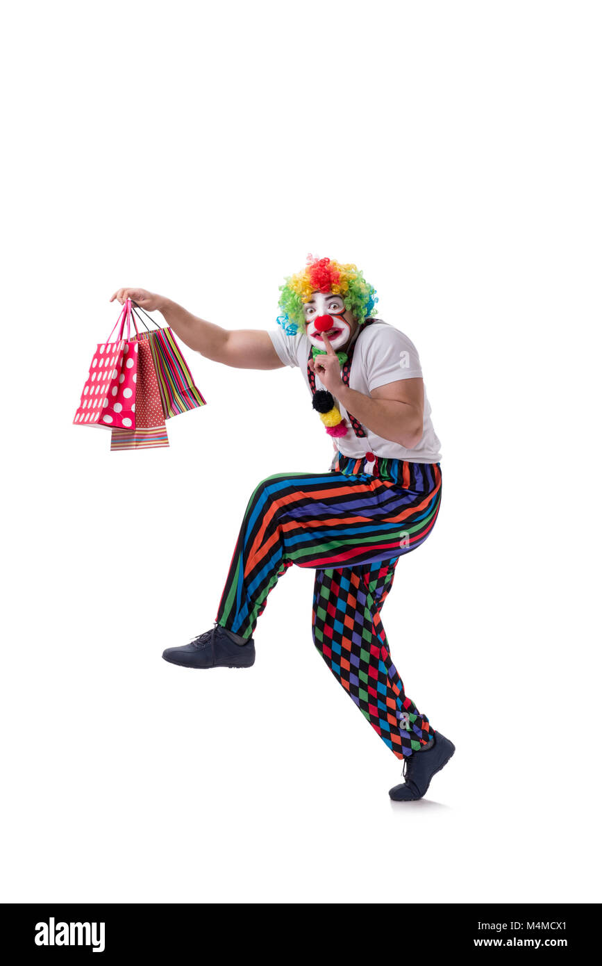 Funny clown with shopping bags isolated on white background Stock Photo ...