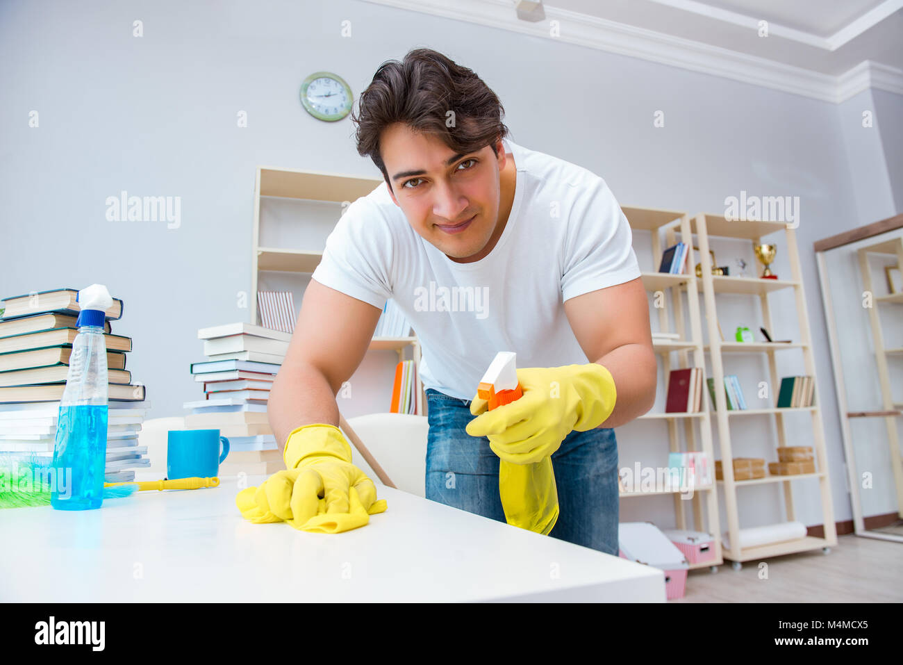 Man doing cleaning at home Stock Photo - Alamy