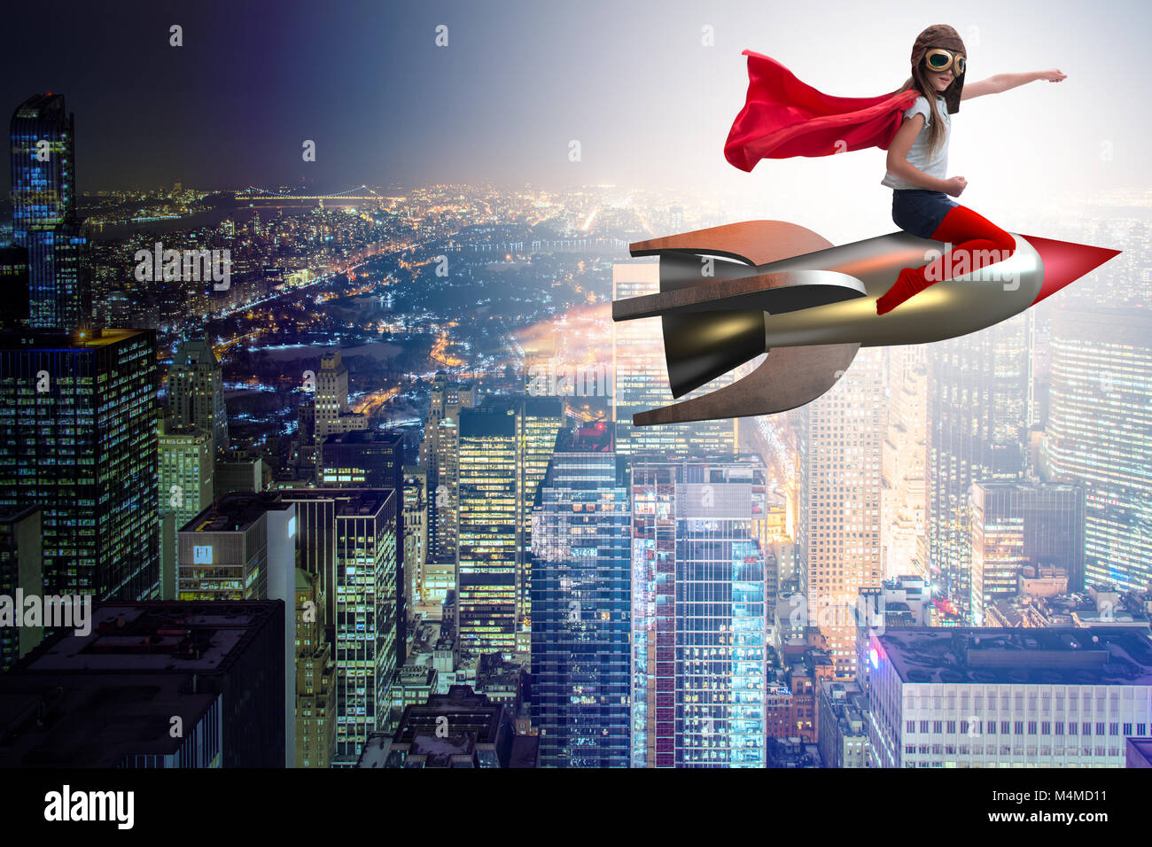 Little girl flying rocket in superhero concept Stock Photo - Alamy