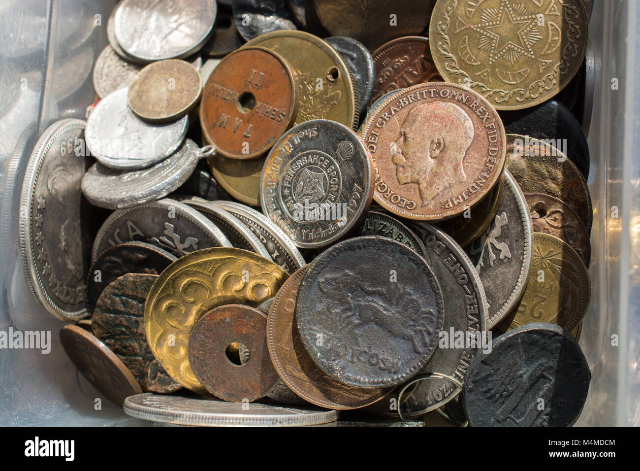 Old metal coin collectiions of various currencies Stock Photo - Alamy