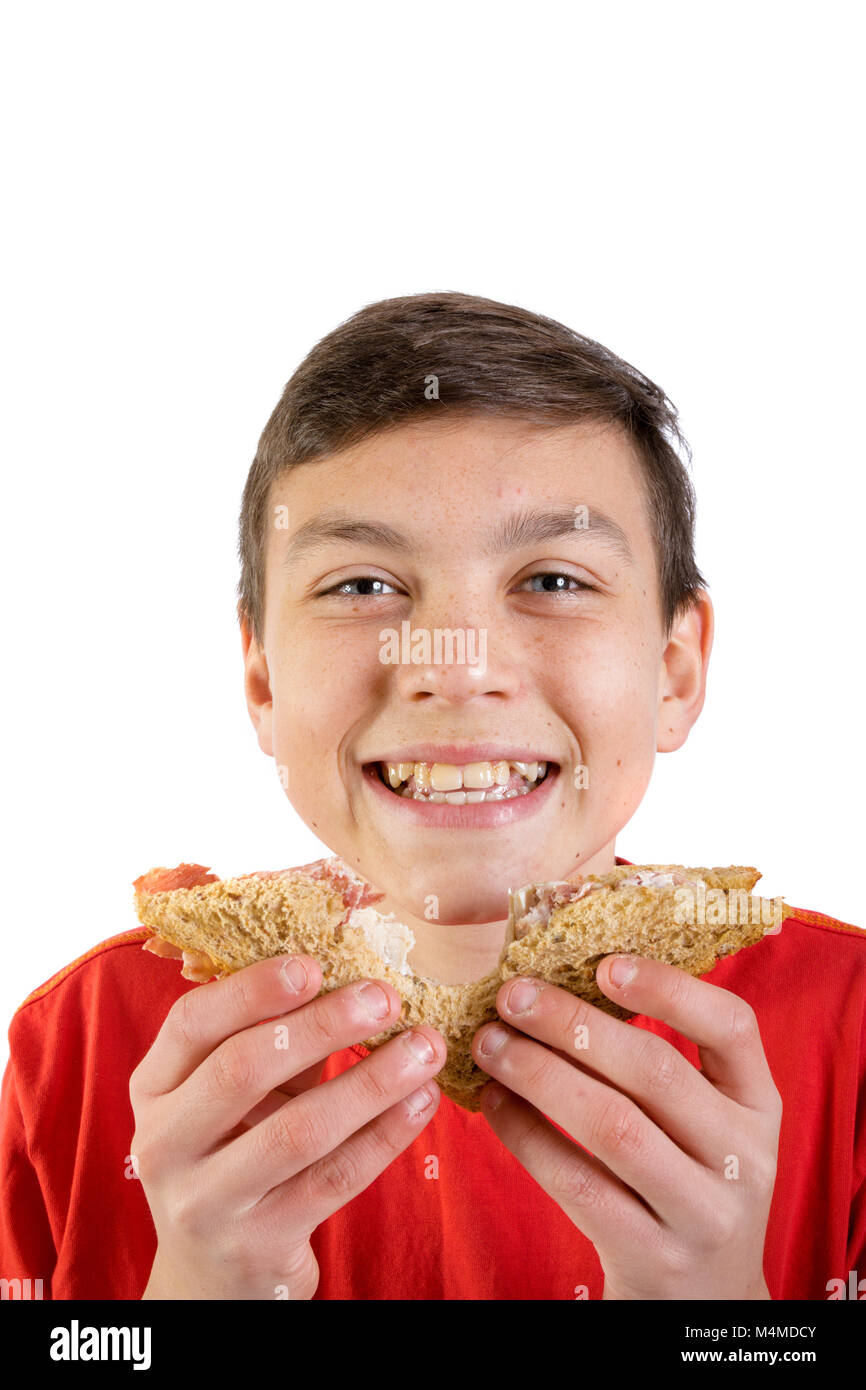 Young caucasian teenage boy eating a sandwich Stock Photo - Alamy