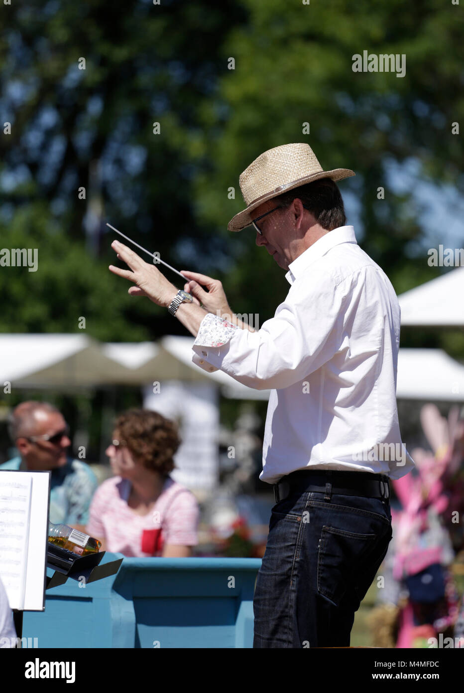 People in traditional clothes making music on a fair Stock Photo - Alamy