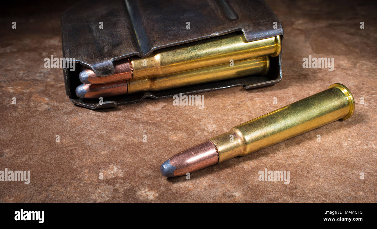 Ammunition for a 303 rifle and magazine on a beige background Stock ...