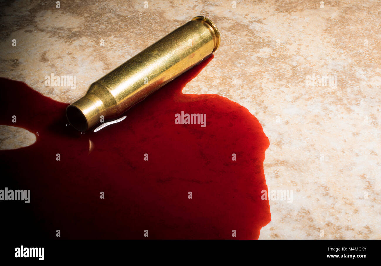 Blood and an empty rifle casing on the floor Stock Photo - Alamy