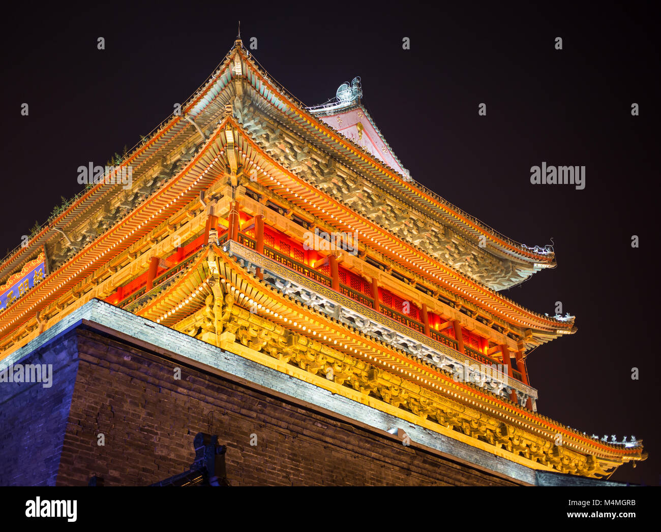 Illuminated famous ancient Bell Tower at night. China, Xian Stock Photo ...