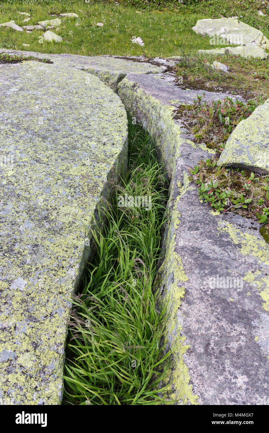 white sharp stones on the hillside of high mountains at sunset Stock ...