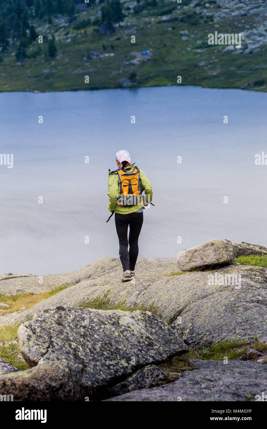 Trail running woman cross country running in mountains on summer ...