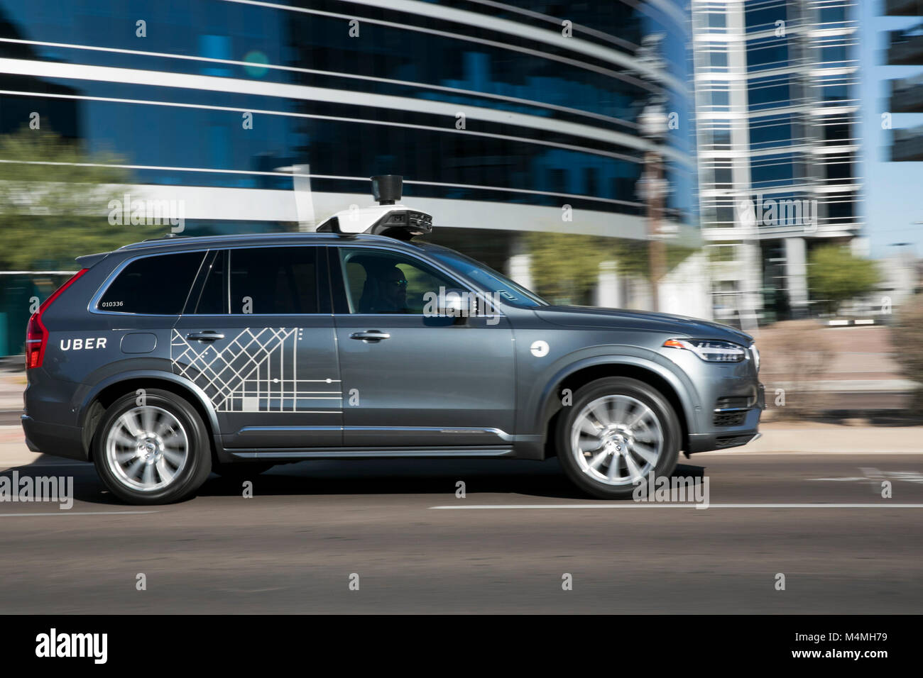 An Uber self-driving autonomous vehicle seen driving in Tempe, Arizona ...