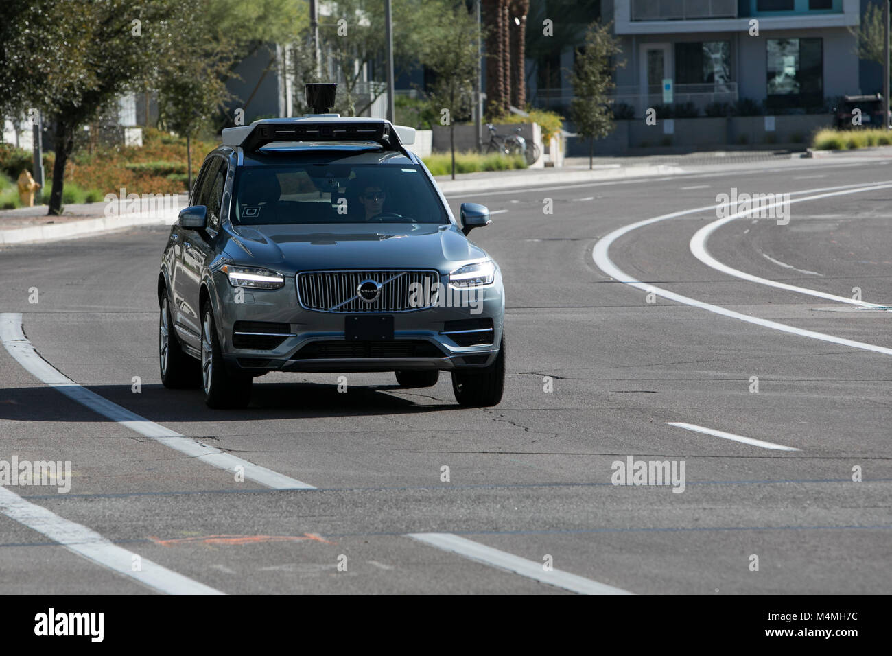 An Uber self-driving autonomous vehicle seen driving in Tempe, Arizona ...