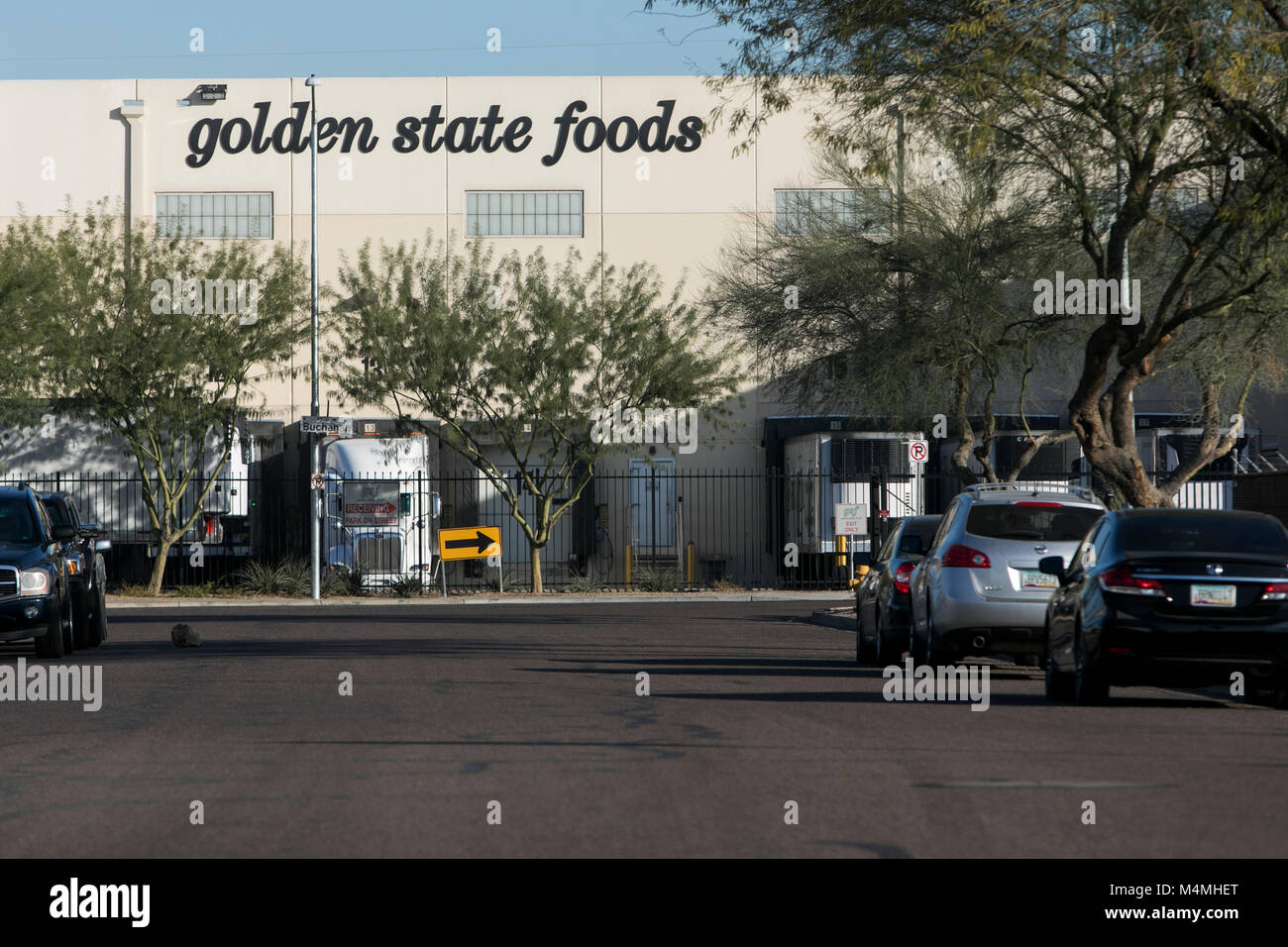 A logo sign outside of a facility occupied by Golden State Foods in ...