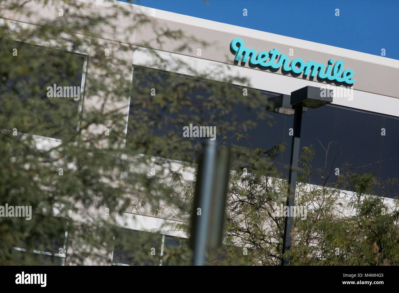 A logo sign outside of a facility occupied by Metromile in Tempe ...
