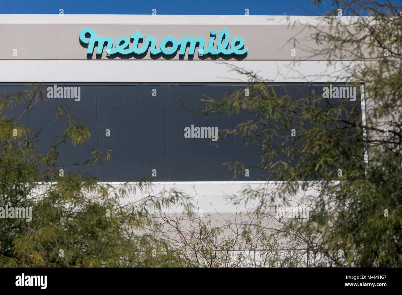 A logo sign outside of a facility occupied by Metromile in Tempe ...