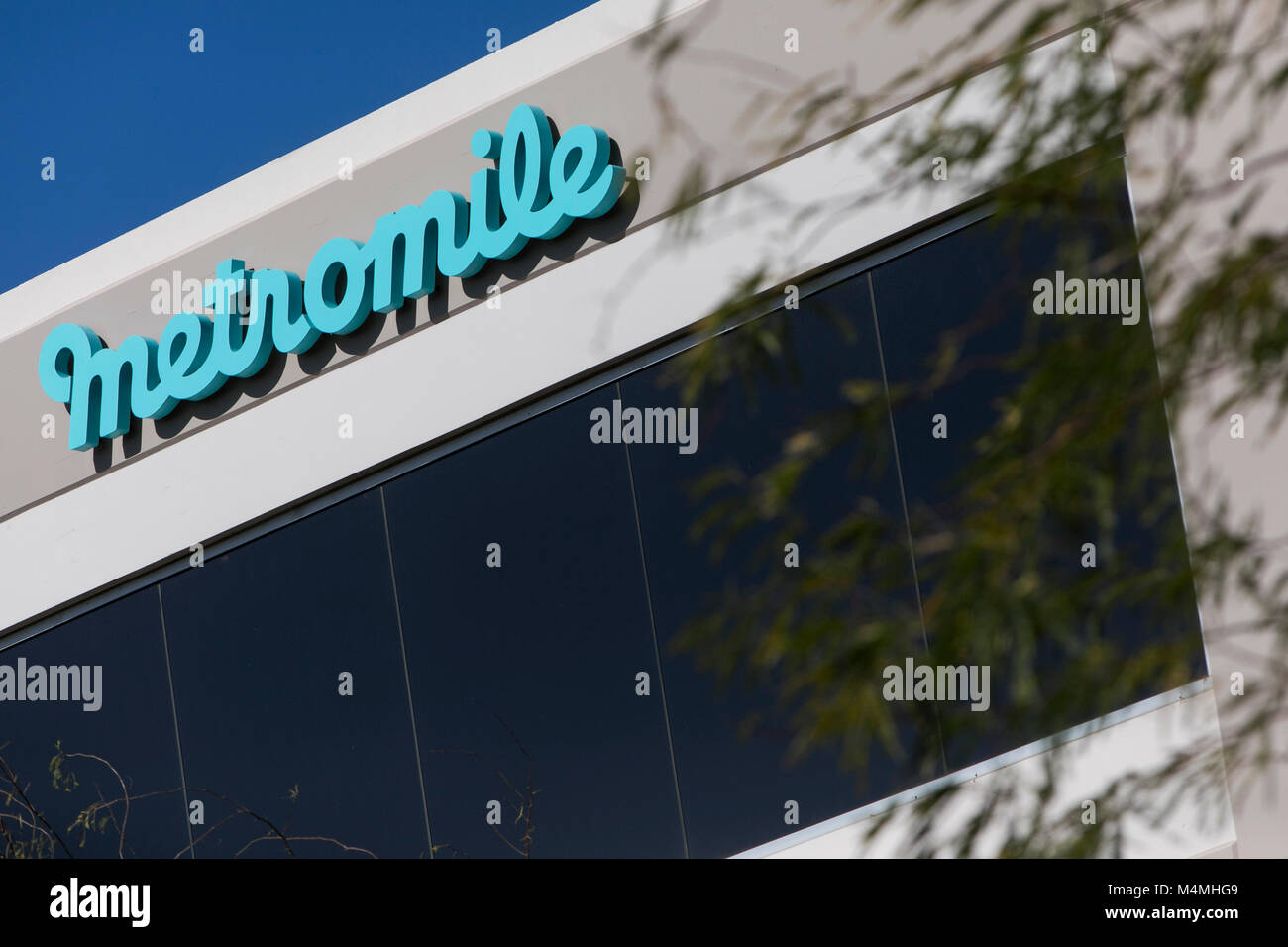 A logo sign outside of a facility occupied by Metromile in Tempe ...