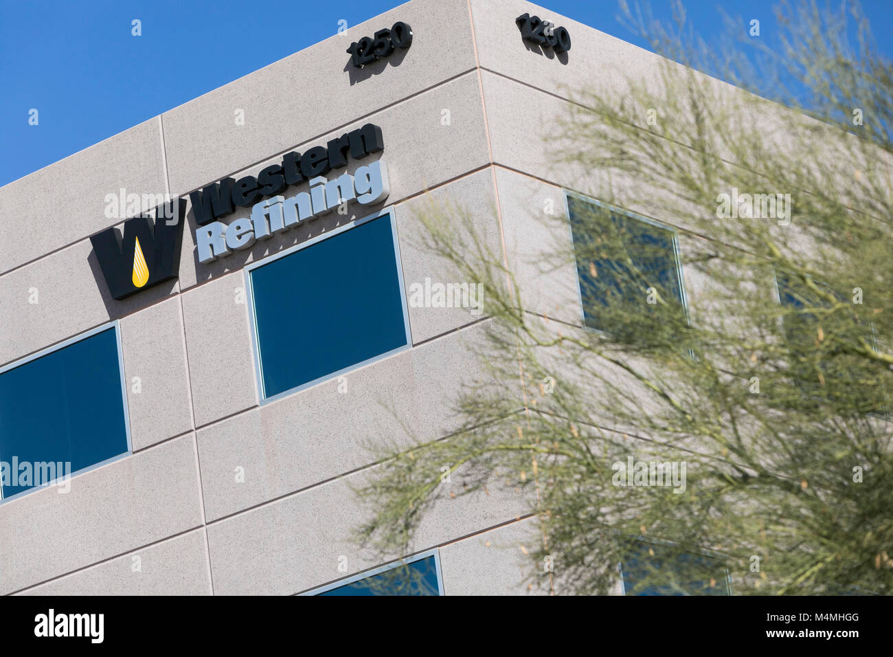A logo sign outside of a facility occupied by Western Refining, Inc ...