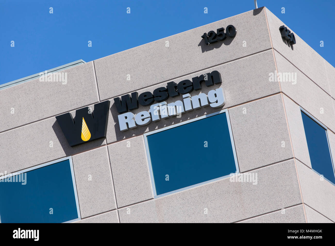 A logo sign outside of a facility occupied by Western Refining, Inc ...