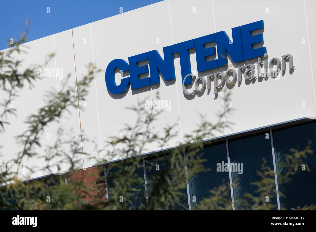 A logo sign outside of a facility occupied by the Centene Corporation ...